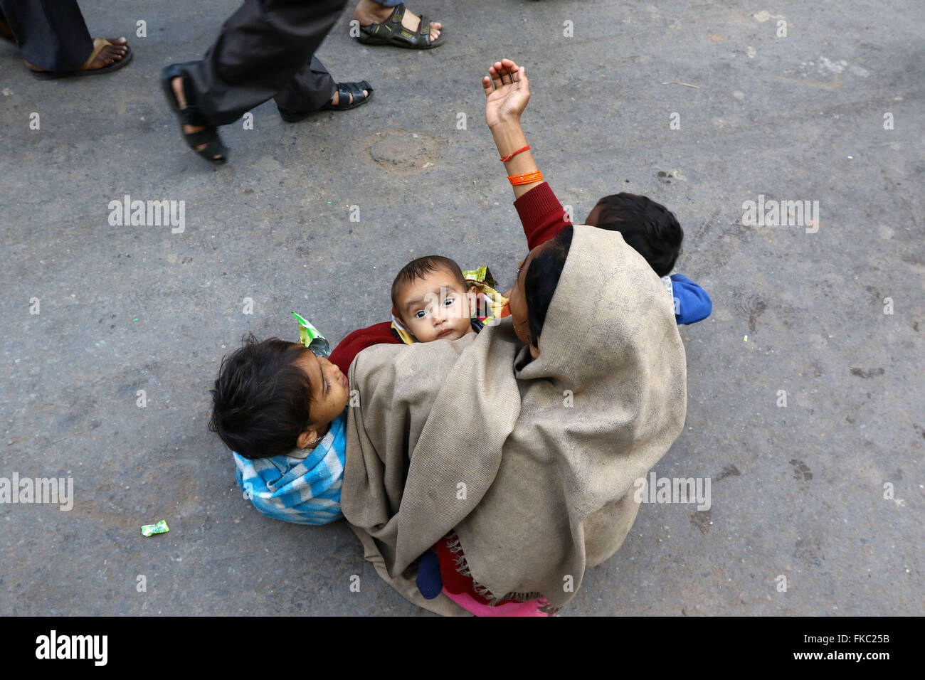 People walking past beggar hi-res stock photography and images - Alamy