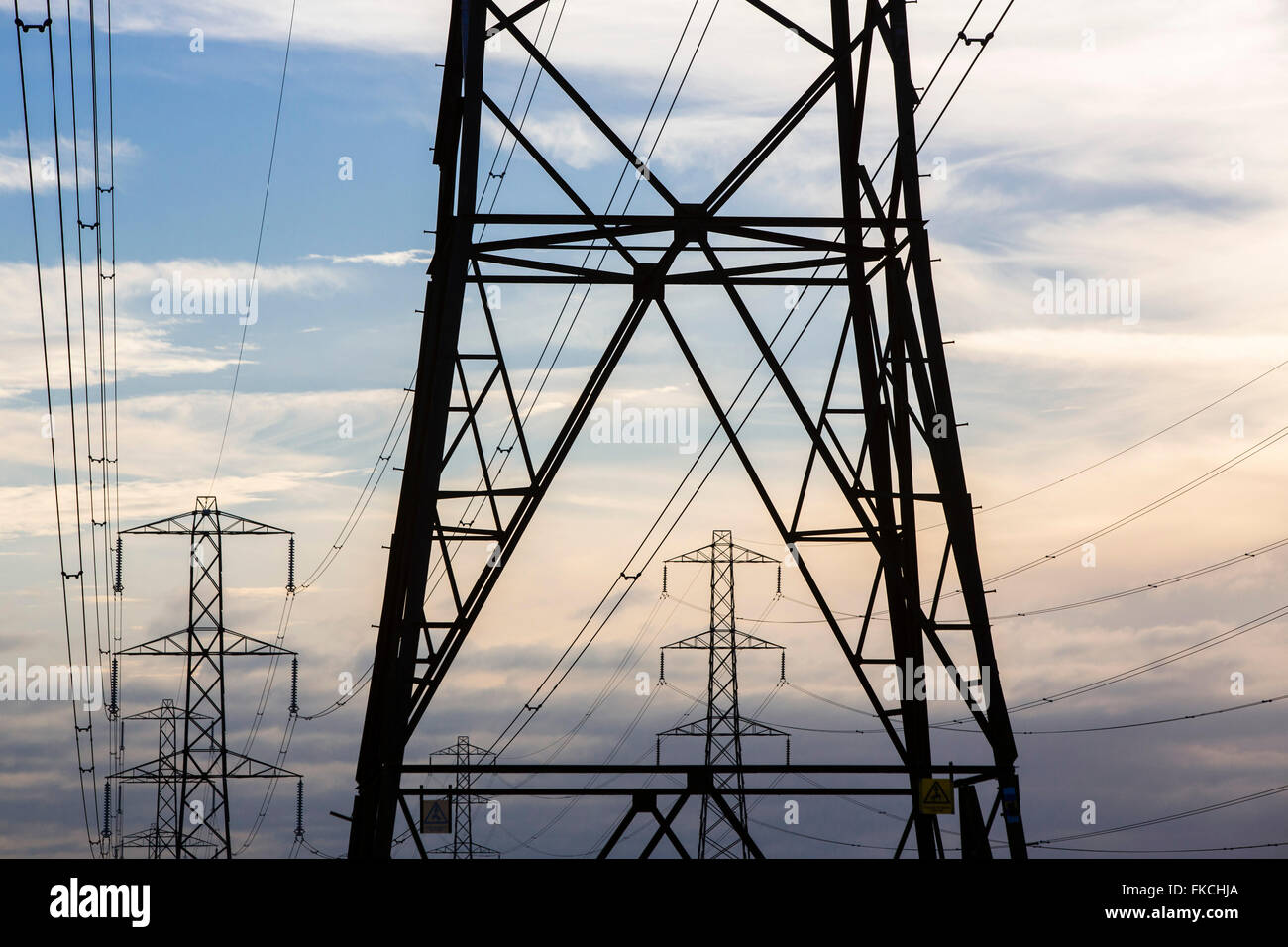 Power lines and pylons stretch into the distance Stock Photo - Alamy
