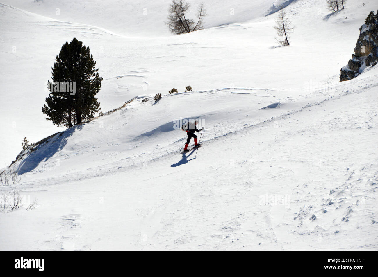Man walking up hill in snow hi-res stock photography and images - Alamy