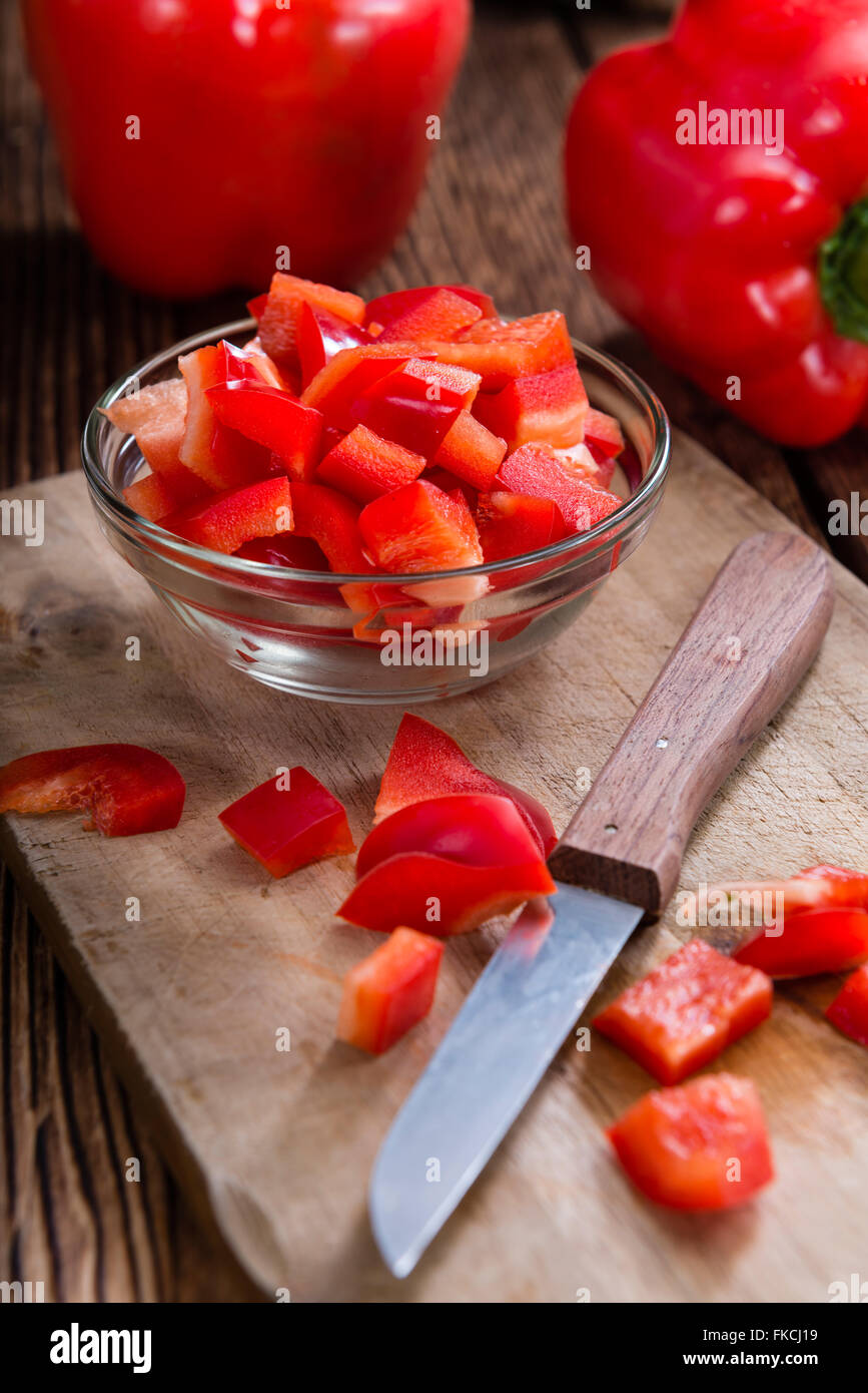 Sliced red Peppers (selective focus) on vintage wooden background Stock ...