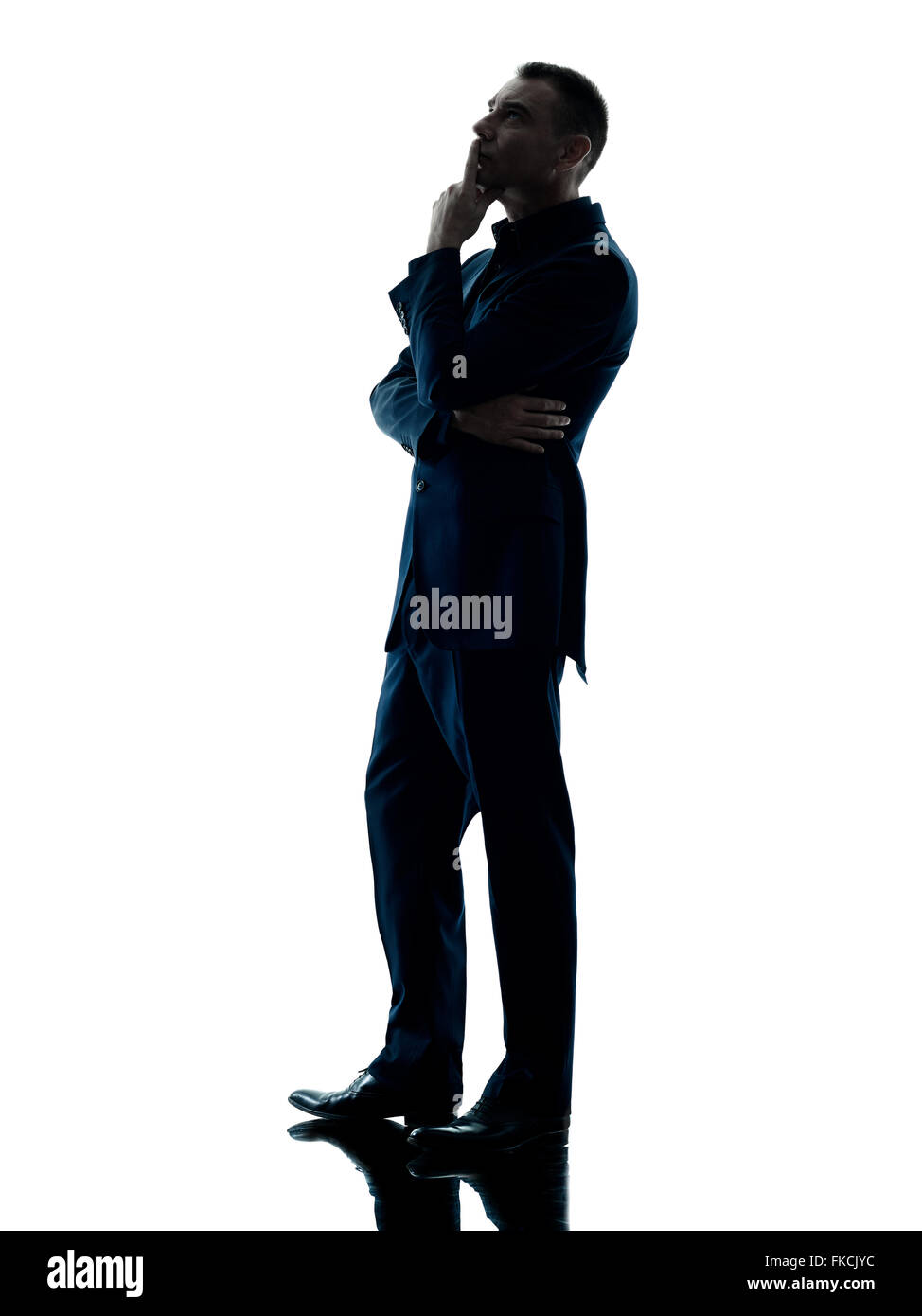 one caucasian business man standing thinking silhouette isolated on white background Stock Photo ...