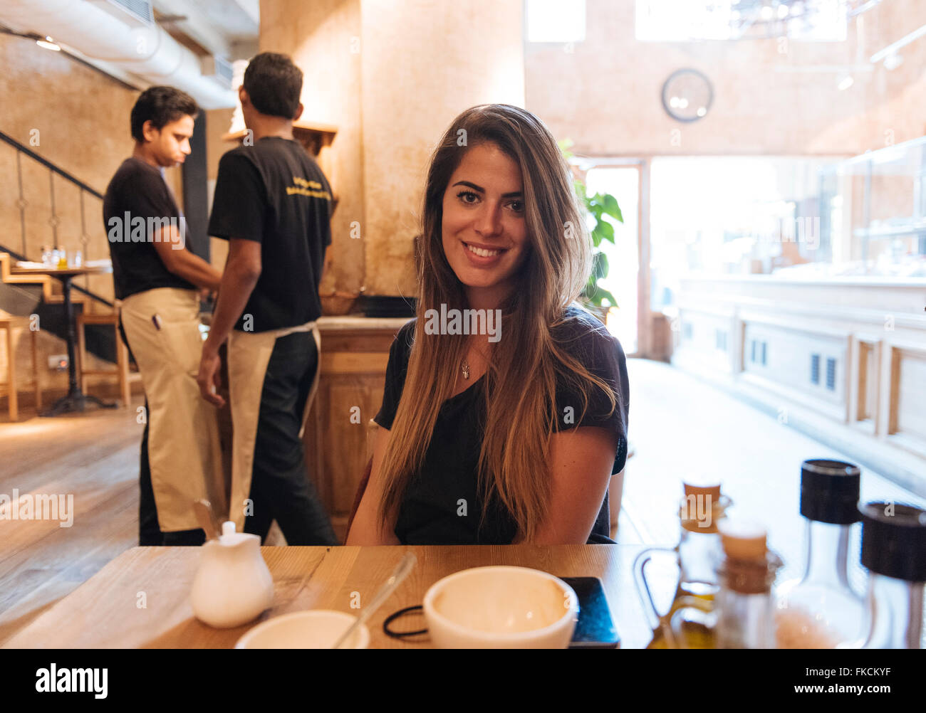 Young woman sitting in cafe, Mumbai, India Stock Photo - Alamy
