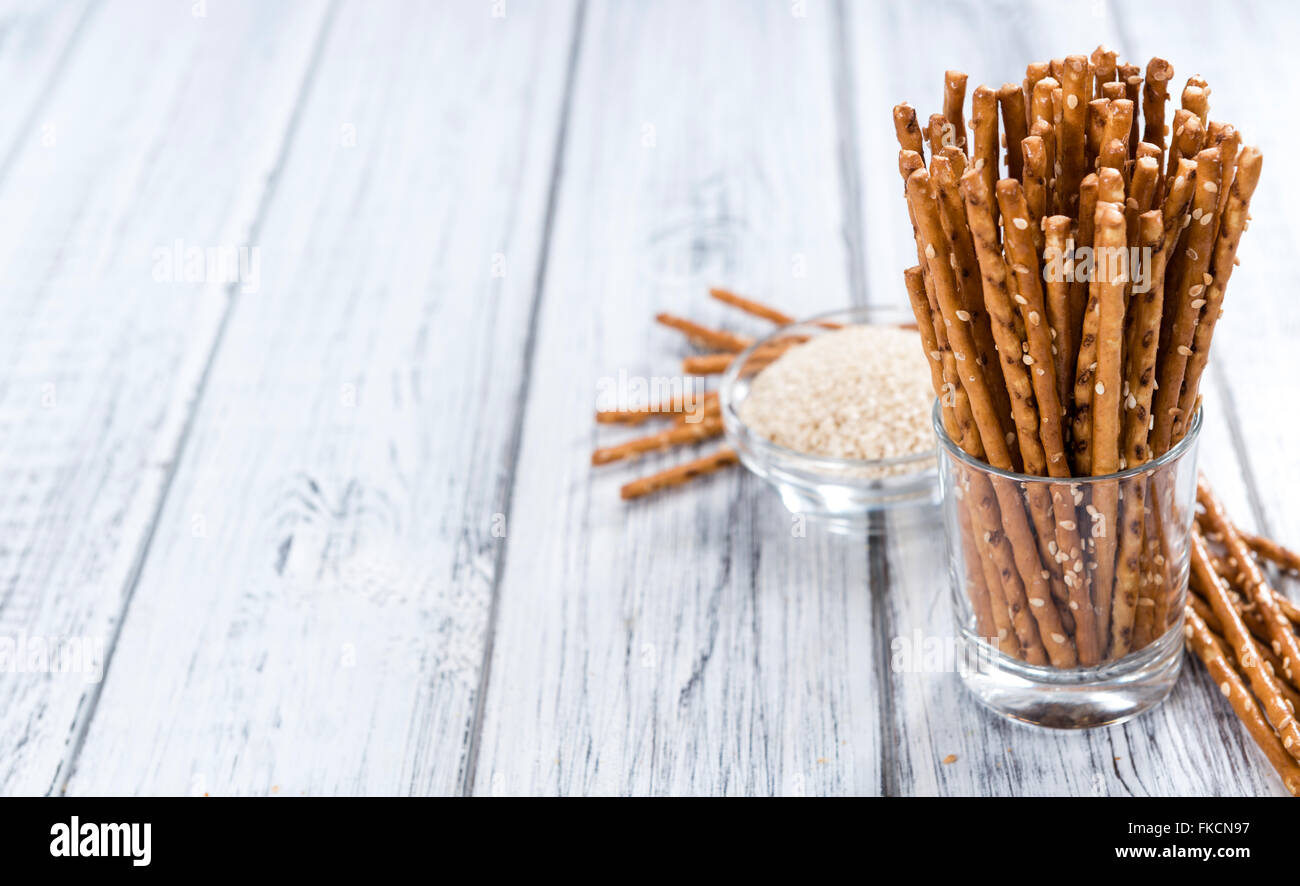 Sesame Sticks (close-up shot) on wooden background Stock Photo - Alamy