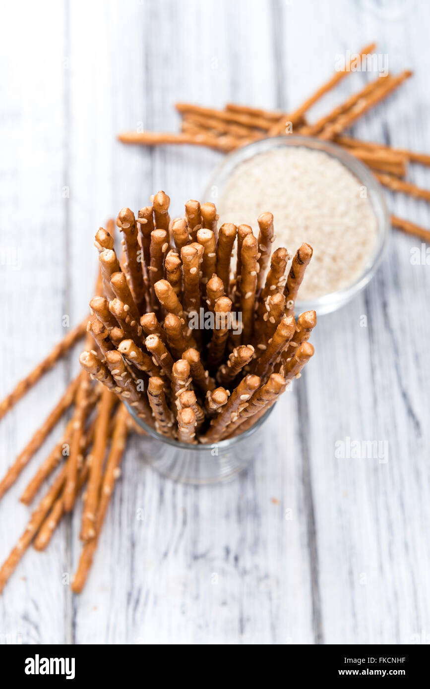 Sesame Sticks (close-up shot) on wooden background Stock Photo - Alamy