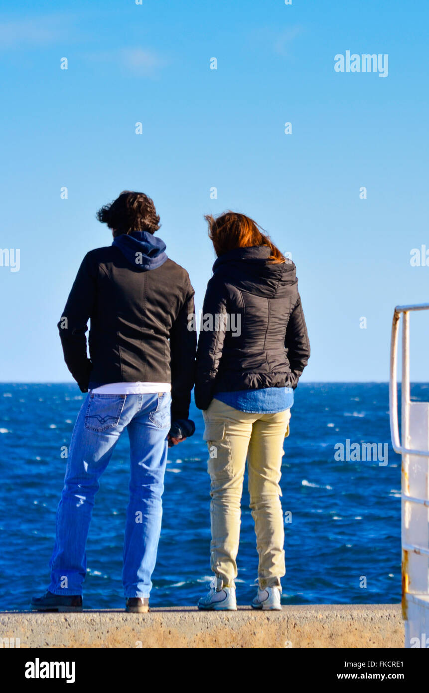 Couple watching the sea Stock Photo - Alamy