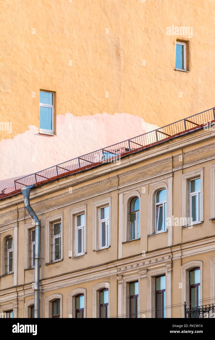 Facades of two separate apartment buildings with different number of ...