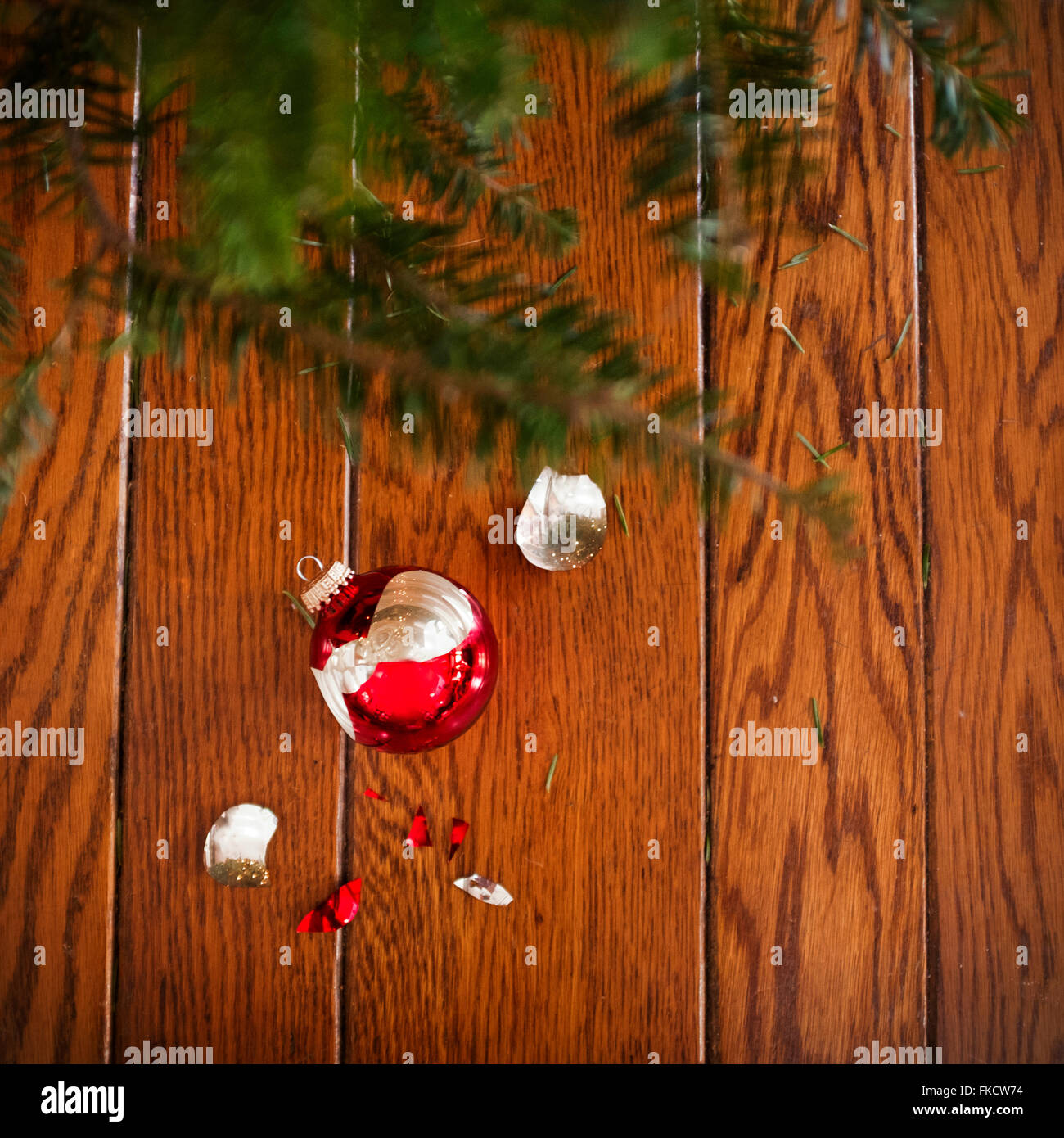 Broken christmas ornament on floor Stock Photo - Alamy