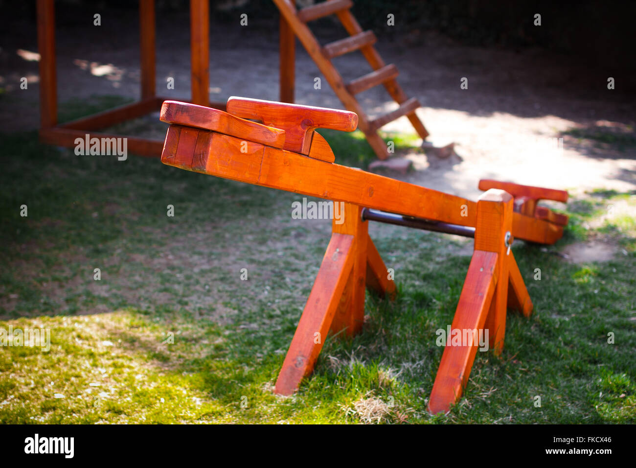 New wood seesaw at kindergarten Stock Photo - Alamy