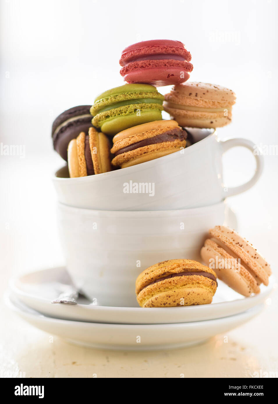 Macaroons in coffee cup Stock Photo - Alamy