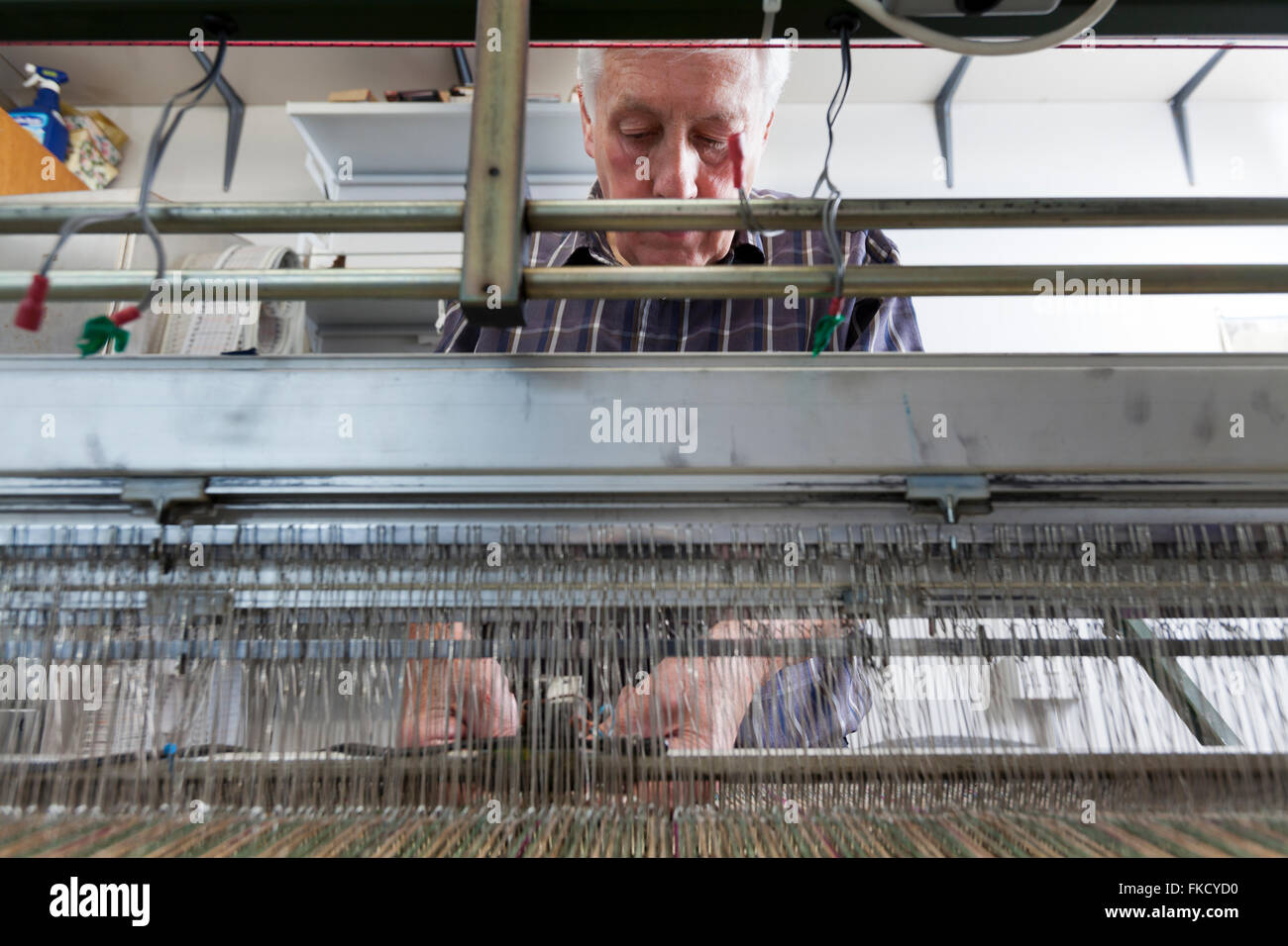 Neil Macleod, Harris tweed weaver, works his loom at home in Stornoway ...