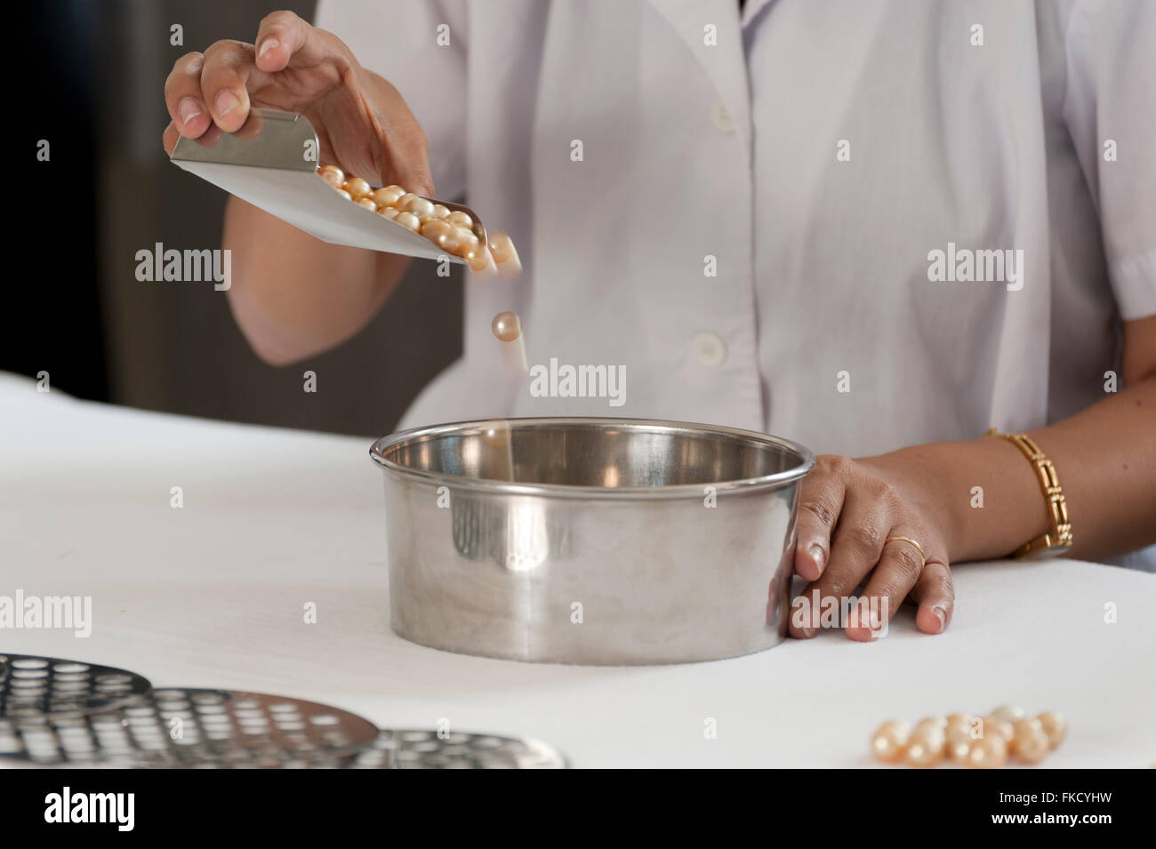 Sorting of Jewelmer pearls in Manila Stock Photo - Alamy