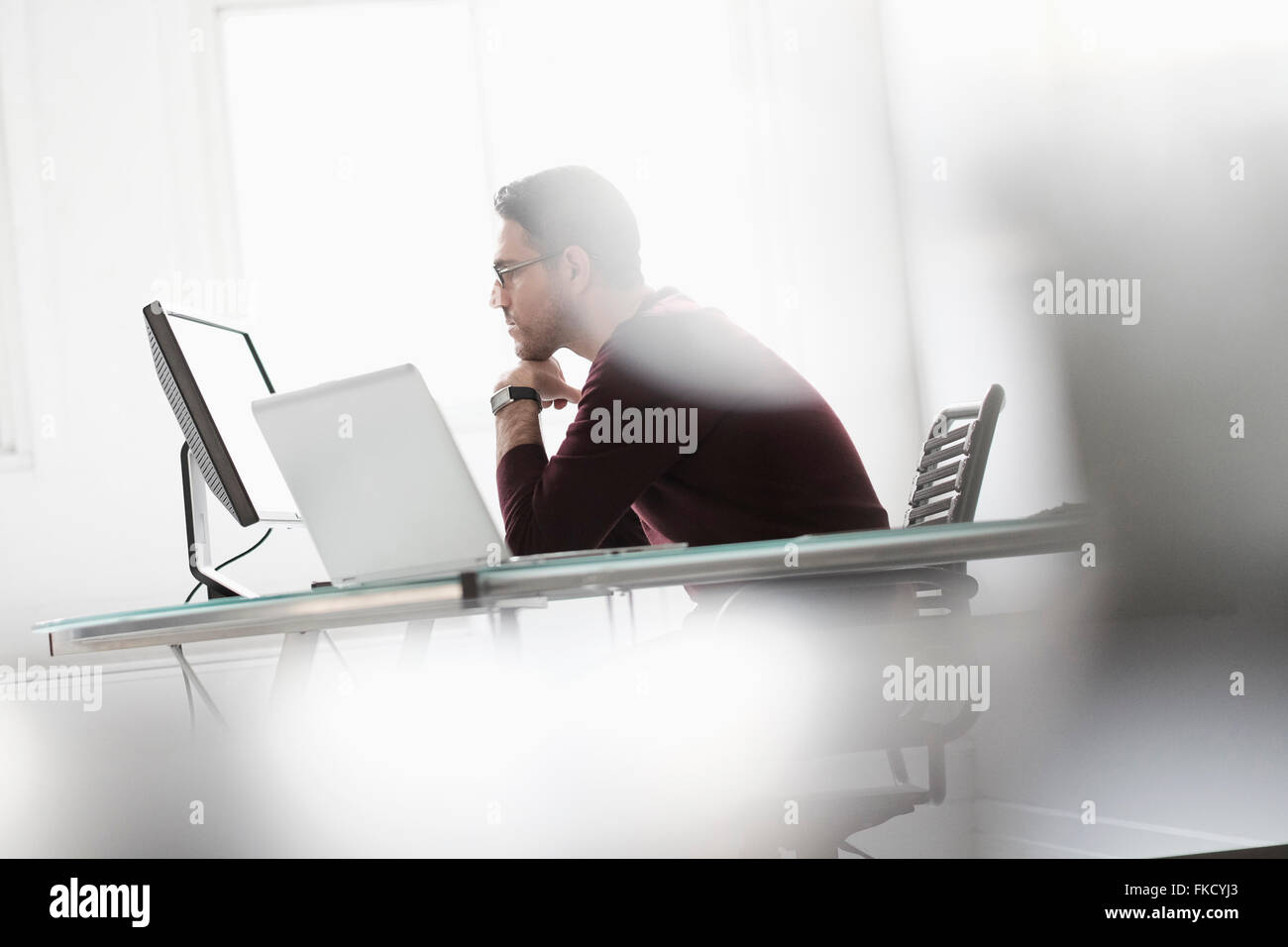 Man using computer in office Stock Photo - Alamy