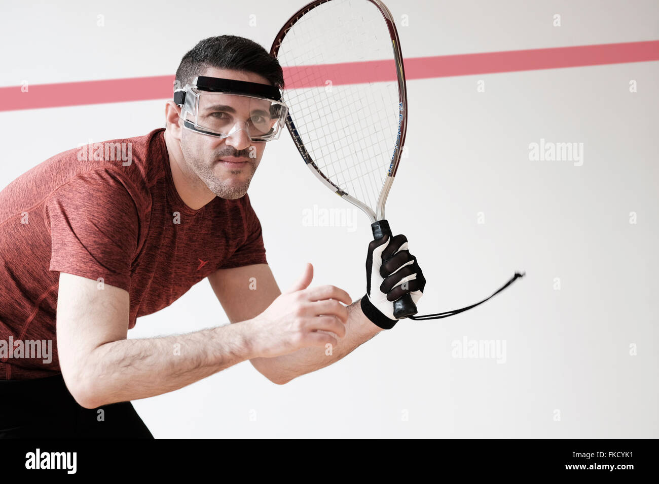 Man playing squash Stock Photo - Alamy