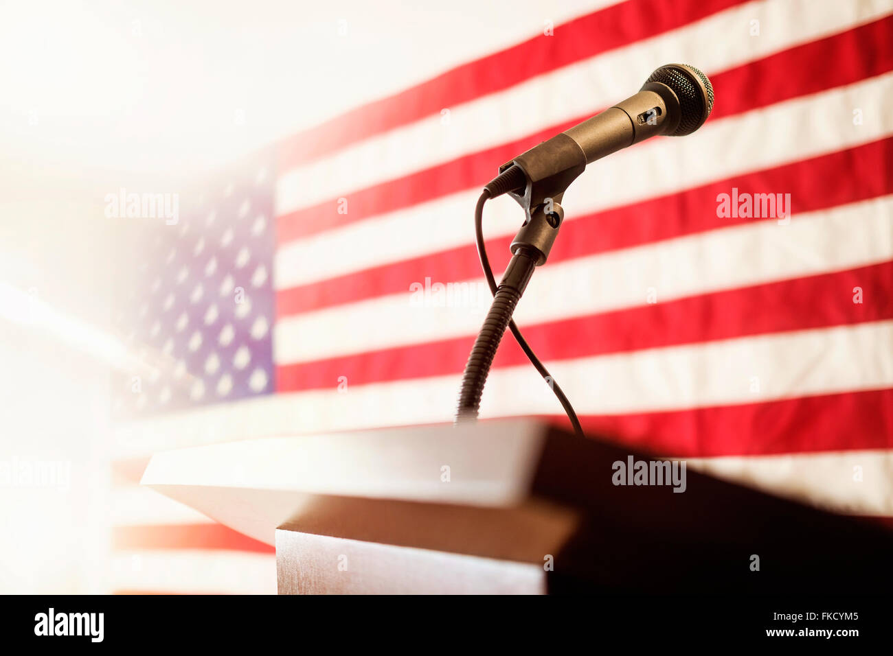 Lectern with American flag in background Stock Photo - Alamy