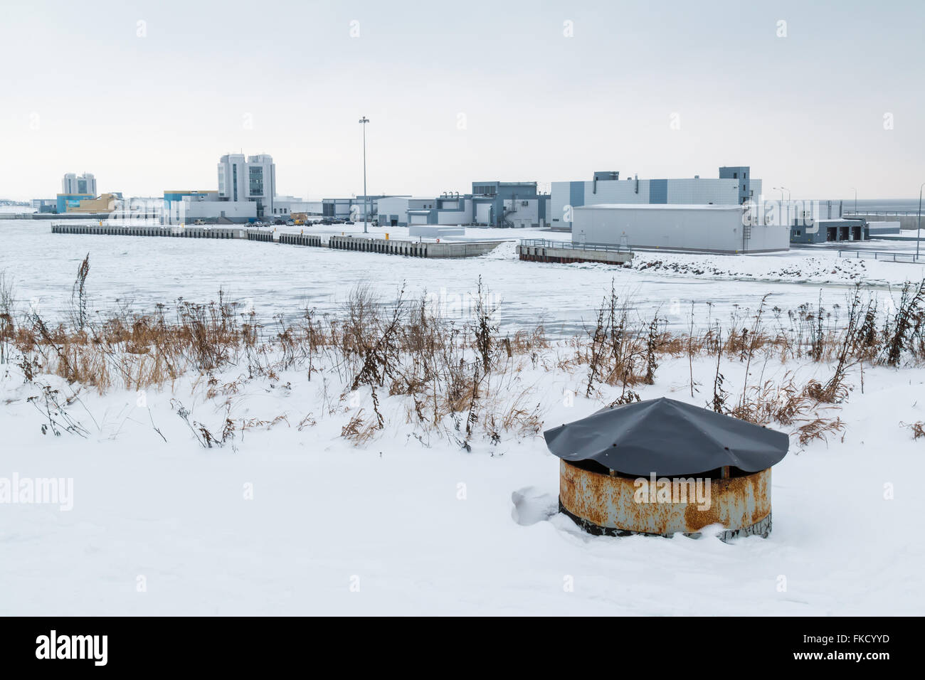 Industrial district on the bay in winter scene Stock Photo - Alamy