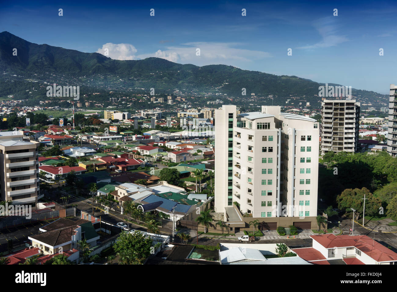 Elevated view of cityscape with mountain range in background, Costa ...