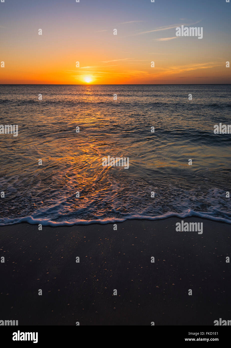 Beach and sea at sunset Stock Photo - Alamy