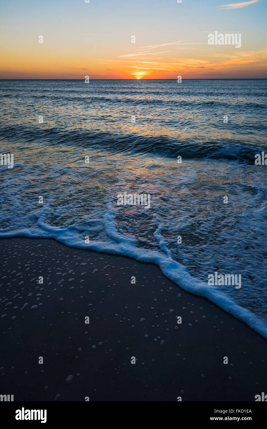 Beach and sea at sunset Stock Photo - Alamy