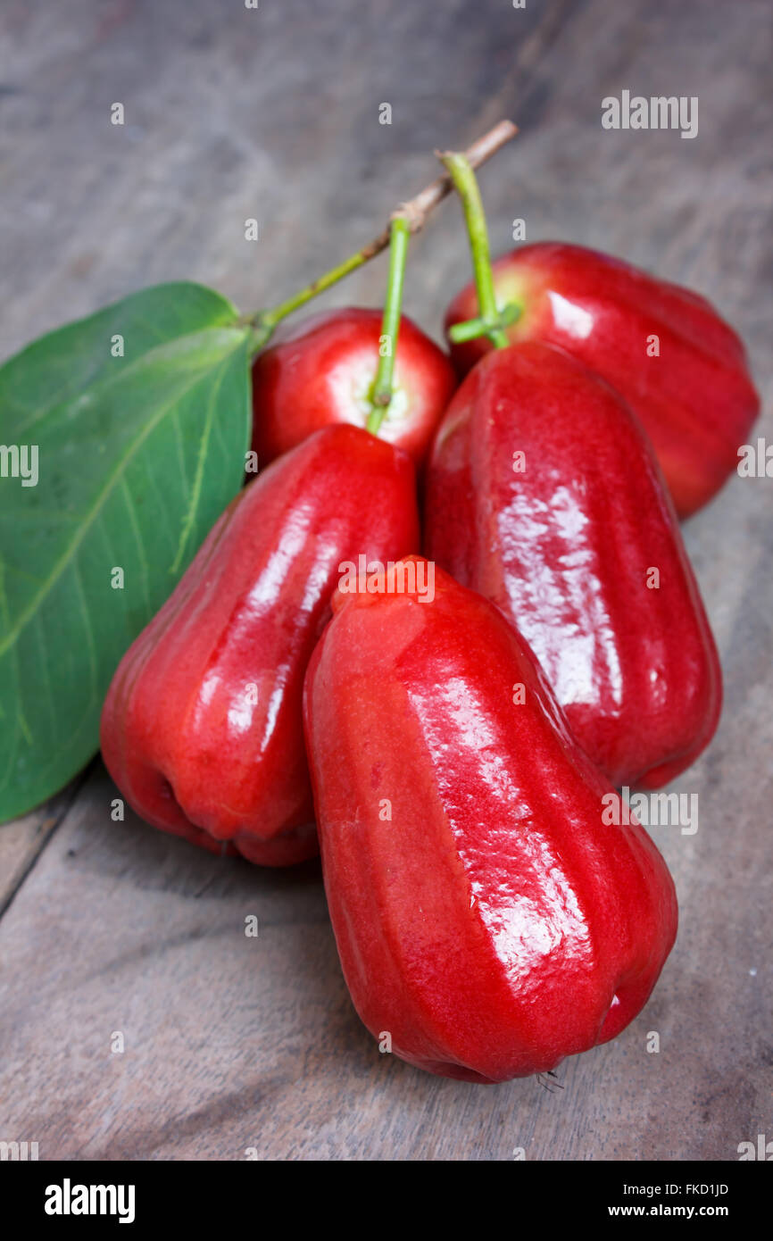 rose apple on old wood, still life Stock Photo - Alamy