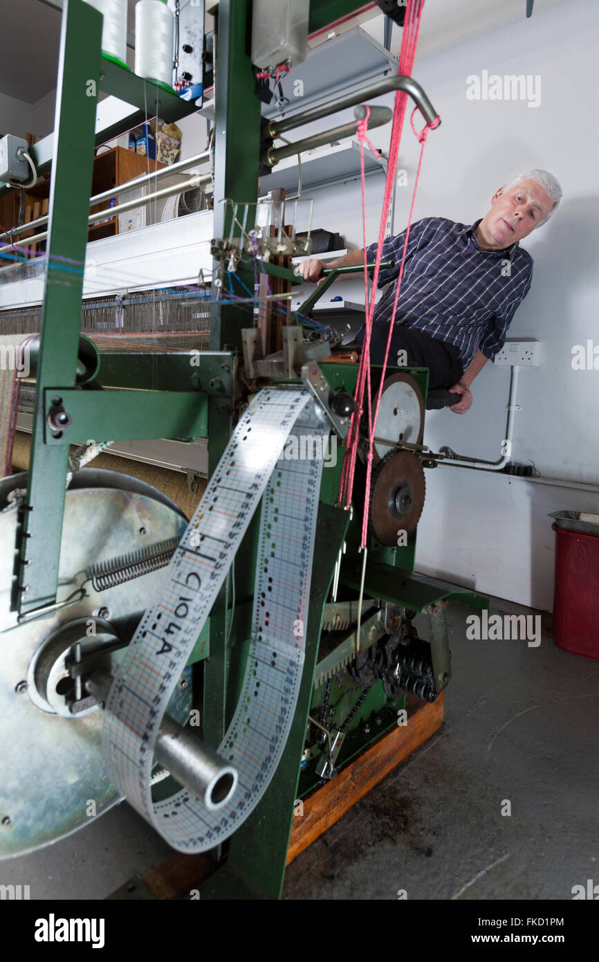 Neil Macleod, Harris tweed weaver, works his loom at home in Stornoway ...