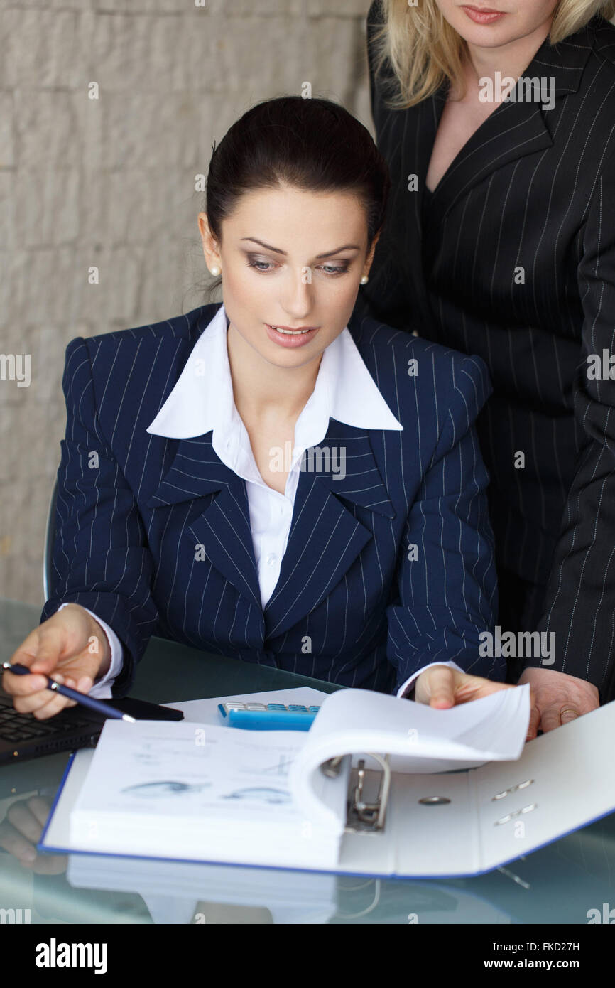 Boss help to employee with product catalog in office, teamwork Stock ...