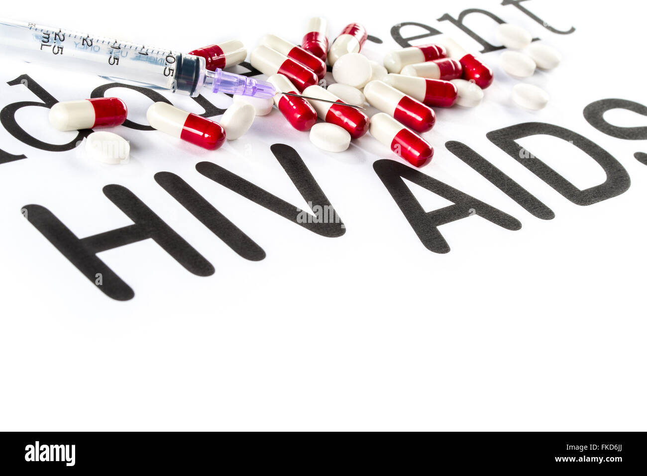 Capsule and Syringe on paper write AIDS and HIV, medication sickness ...