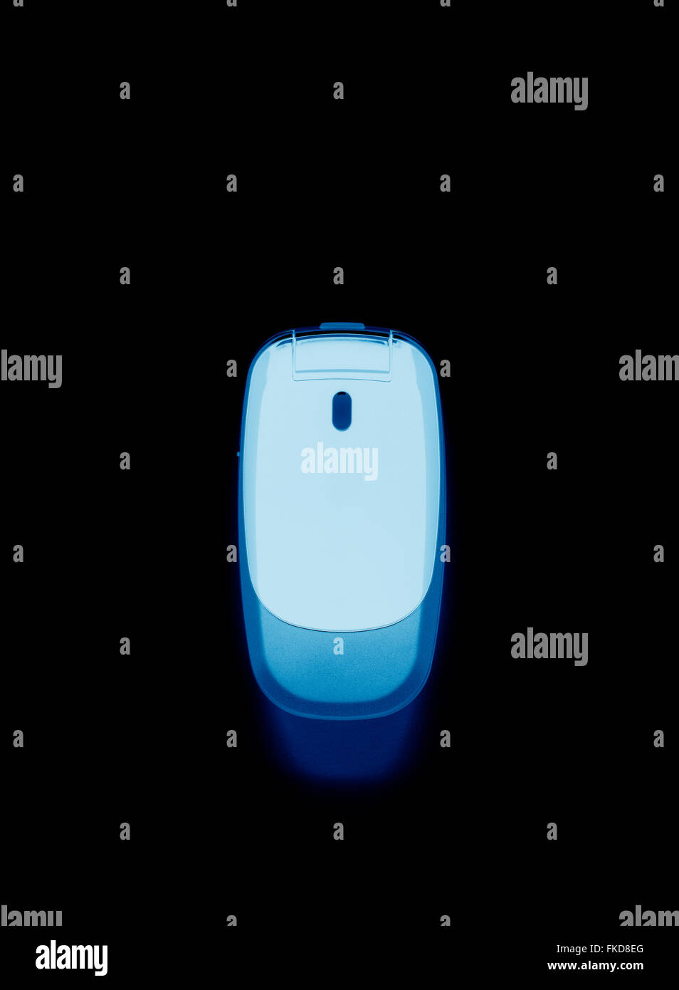 Shell mobile telephone in blue tone isolated on black. Vertical Stock ...