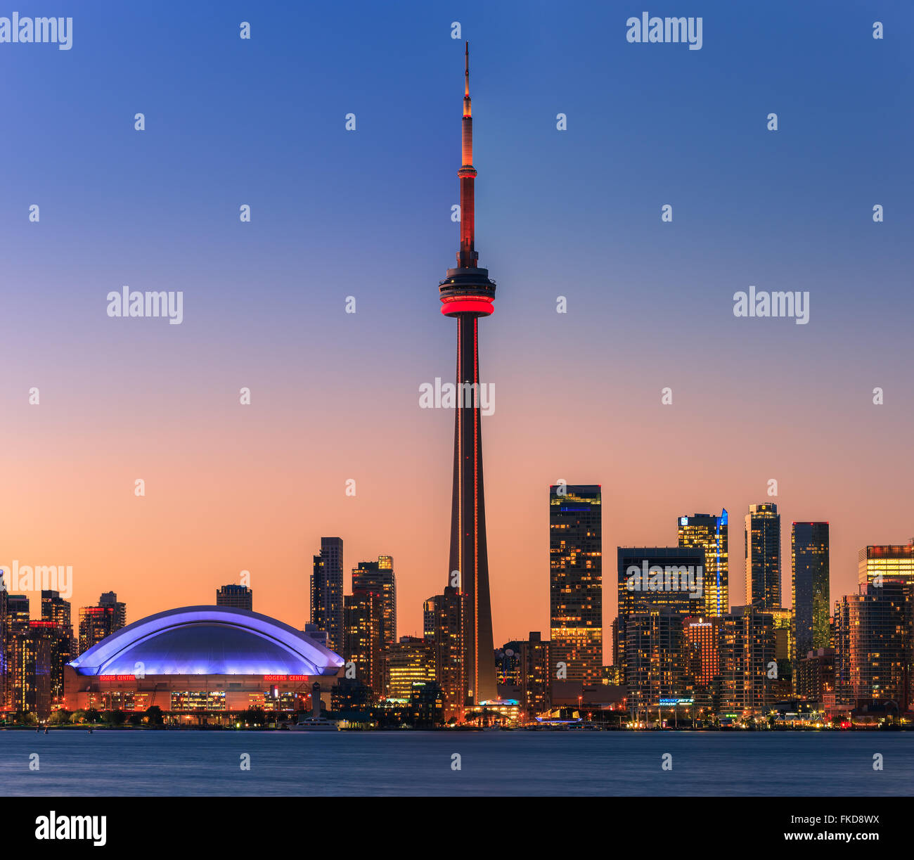 Famous Toronto Skyline with the CN Tower and Rogers Centre after sunset ...