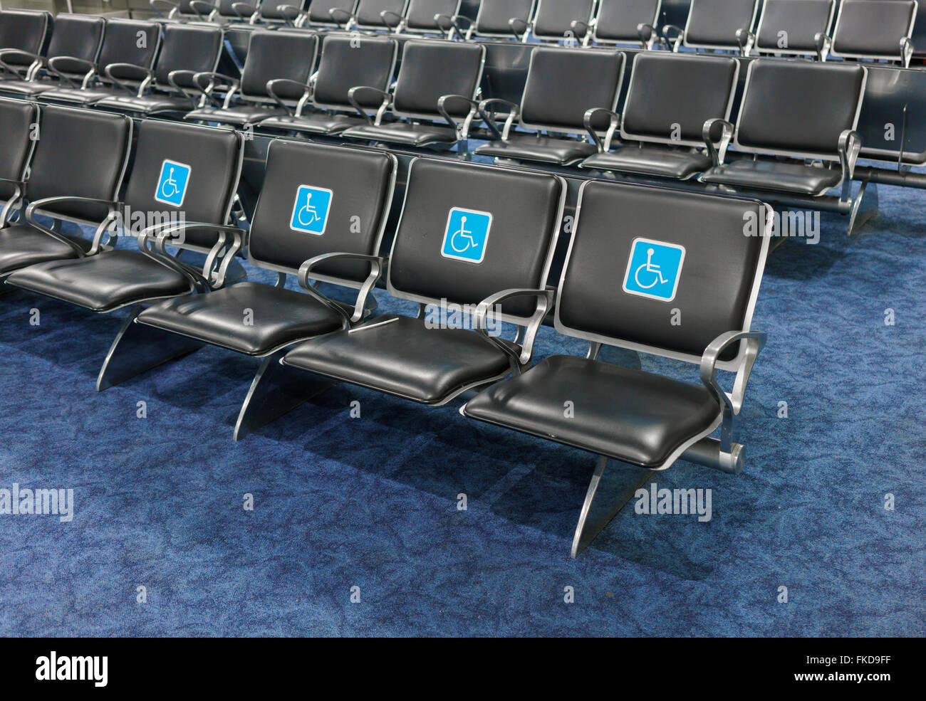 Disabled sign chairs in first row at airport waiting area Stock Photo ...