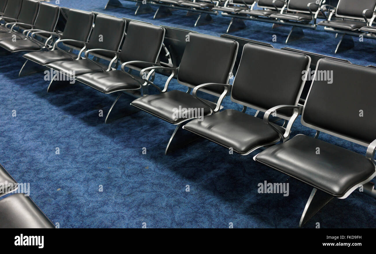 Rows of empty chairs at airport Stock Photo - Alamy