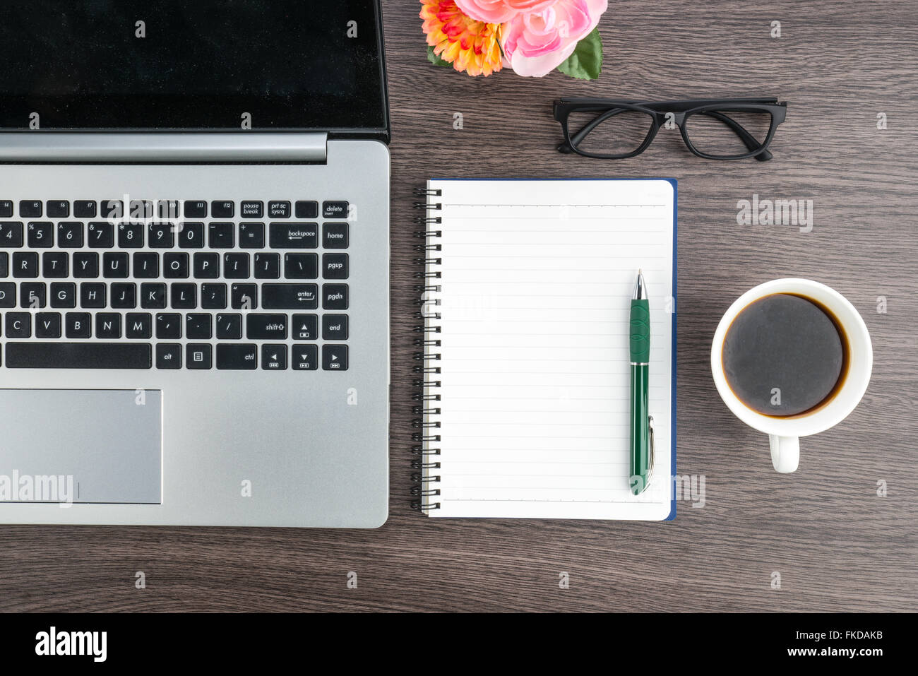 Laptop, notebook and pen with coffee cup on work desk Stock Photo - Alamy