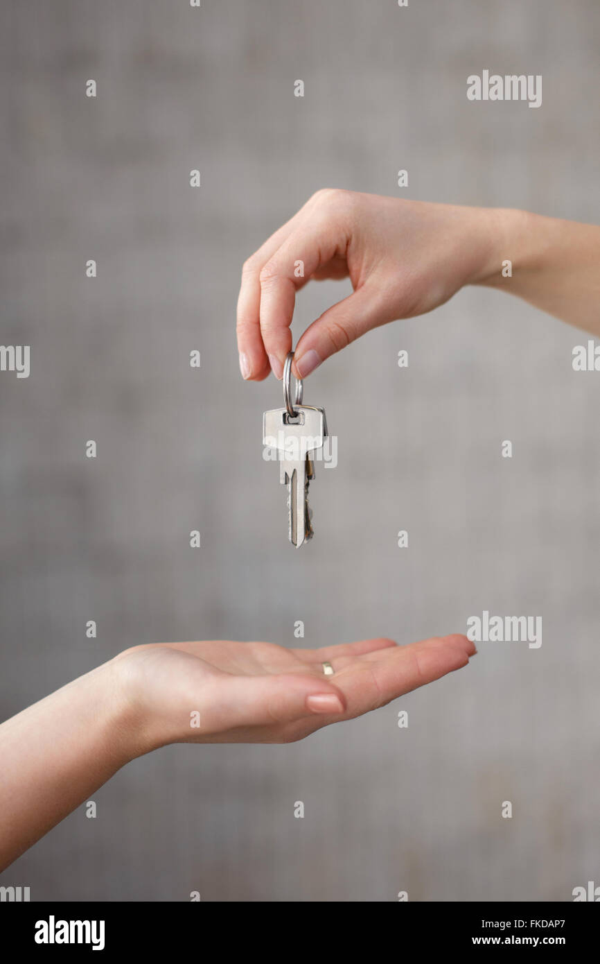 Hand giving key another hand hi-res stock photography and images - Alamy