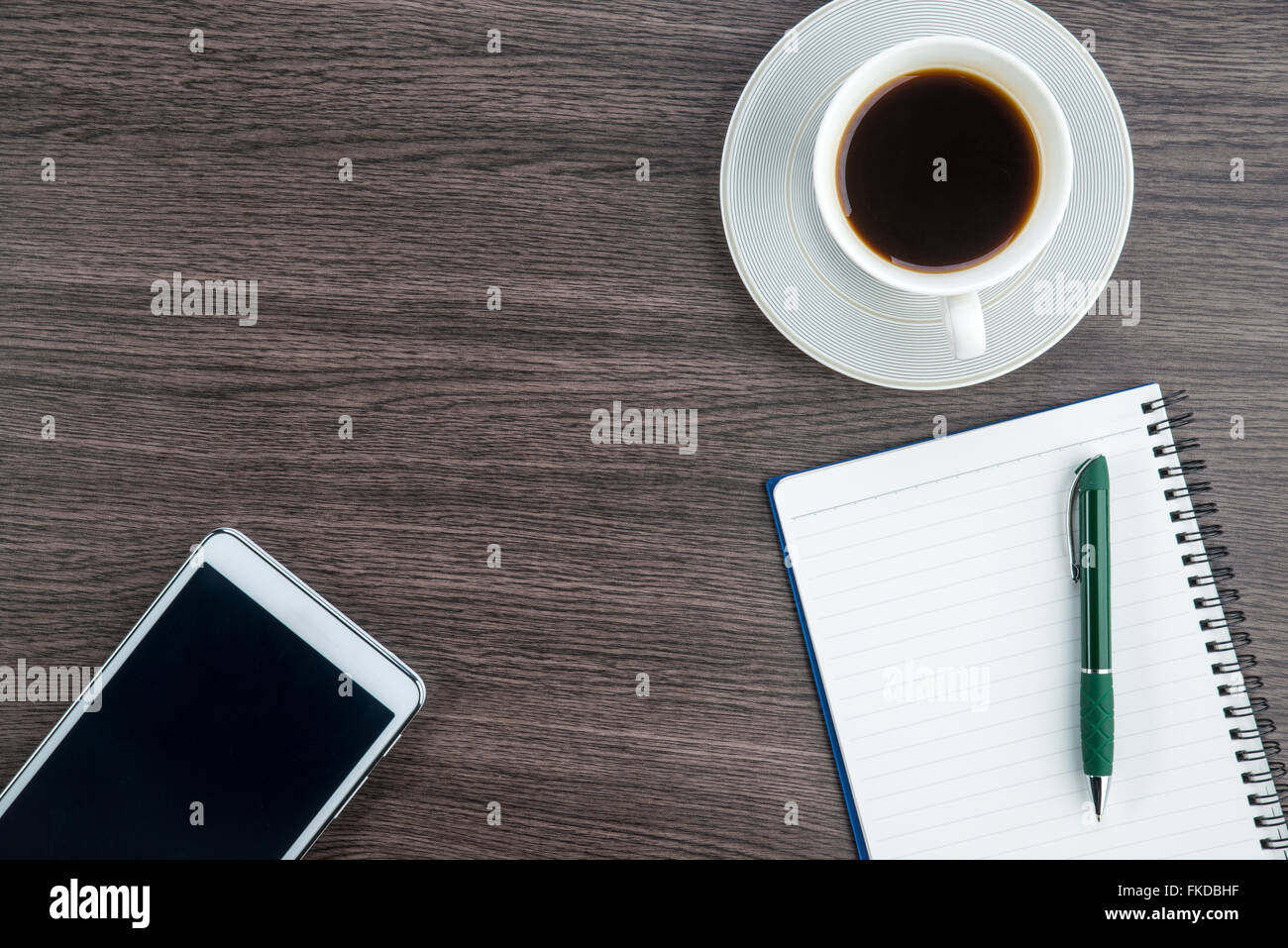 Notepad, notebook and pen with a cup of coffee on work desk Stock Photo ...