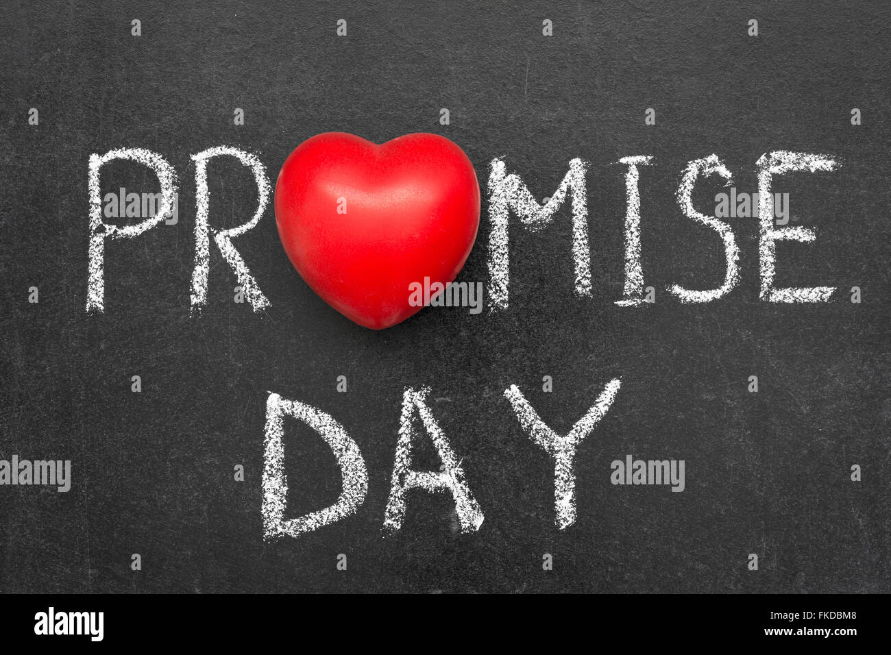 promise day phrase handwritten on blackboard with heart symbol instead ...