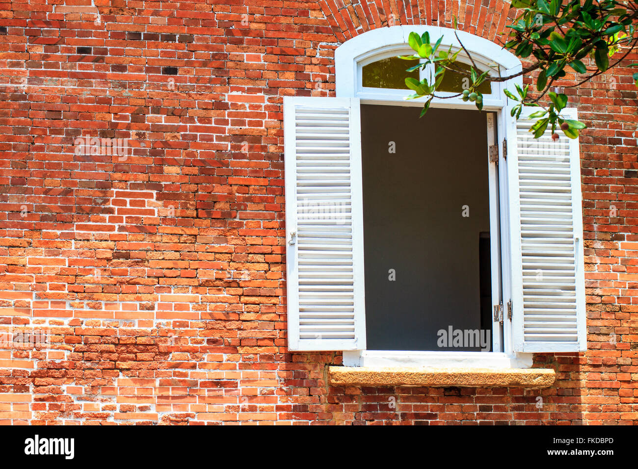 The Old Brick Wall with White Window Stock Photo - Alamy