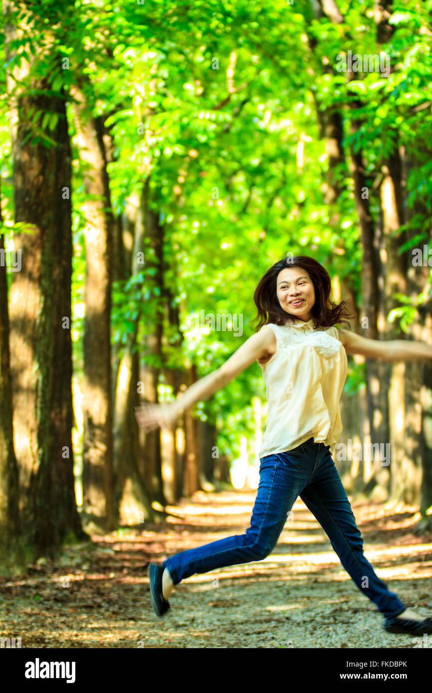 The Country road running through tree with nice color Stock Photo - Alamy