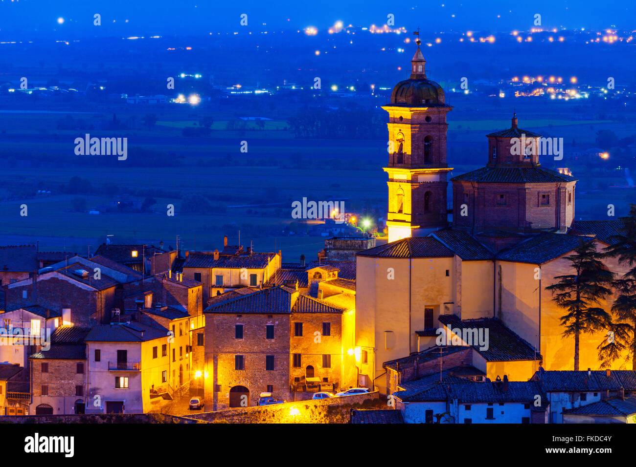 Illuminated townscape at dusk Stock Photo - Alamy