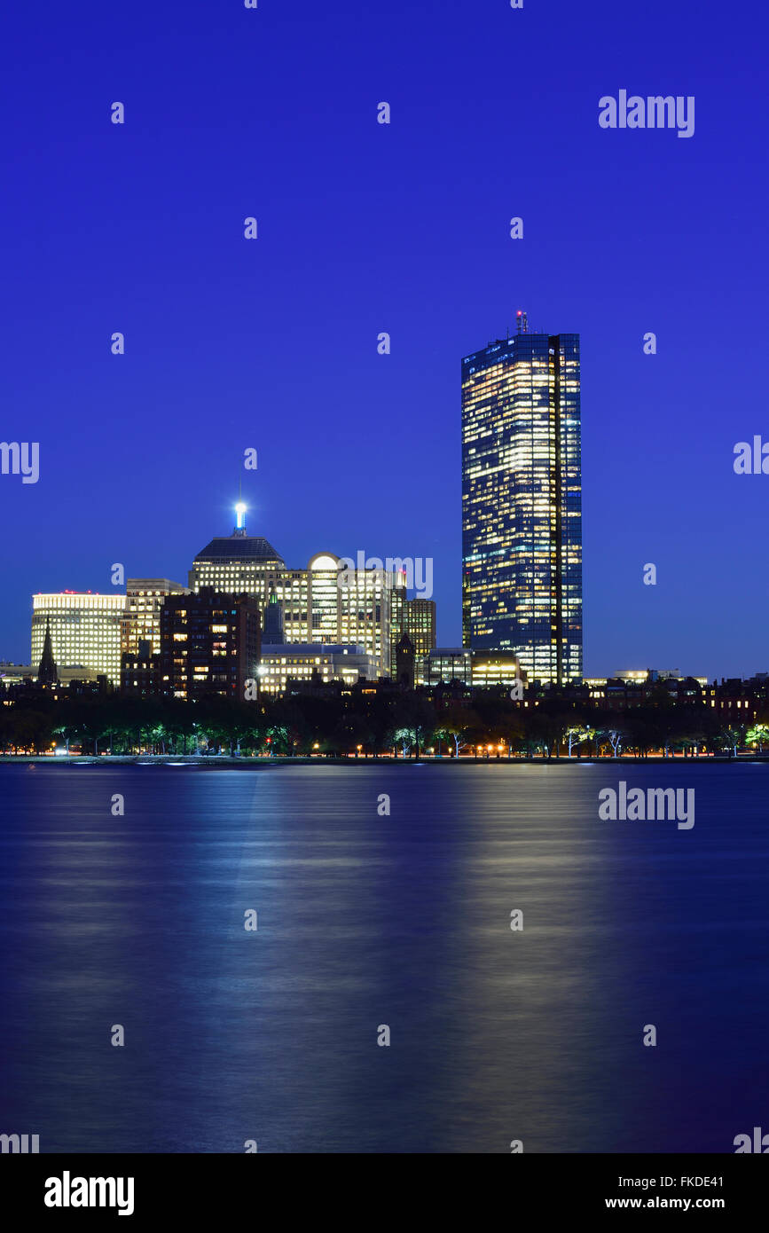 Illuminated waterfront buildings at dusk Stock Photo - Alamy