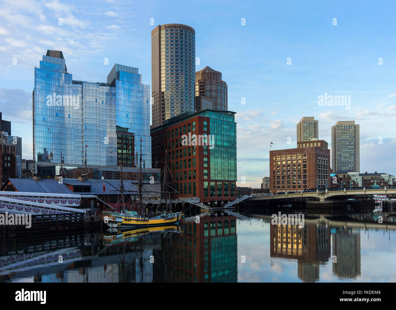 Waterfront buildings reflecting in water Stock Photo - Alamy