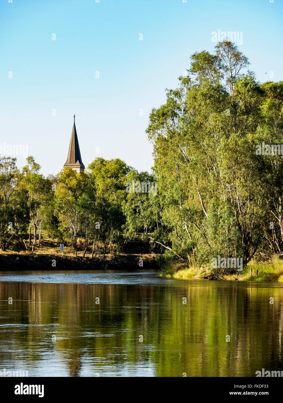 Trees reflecting in river Stock Photo - Alamy