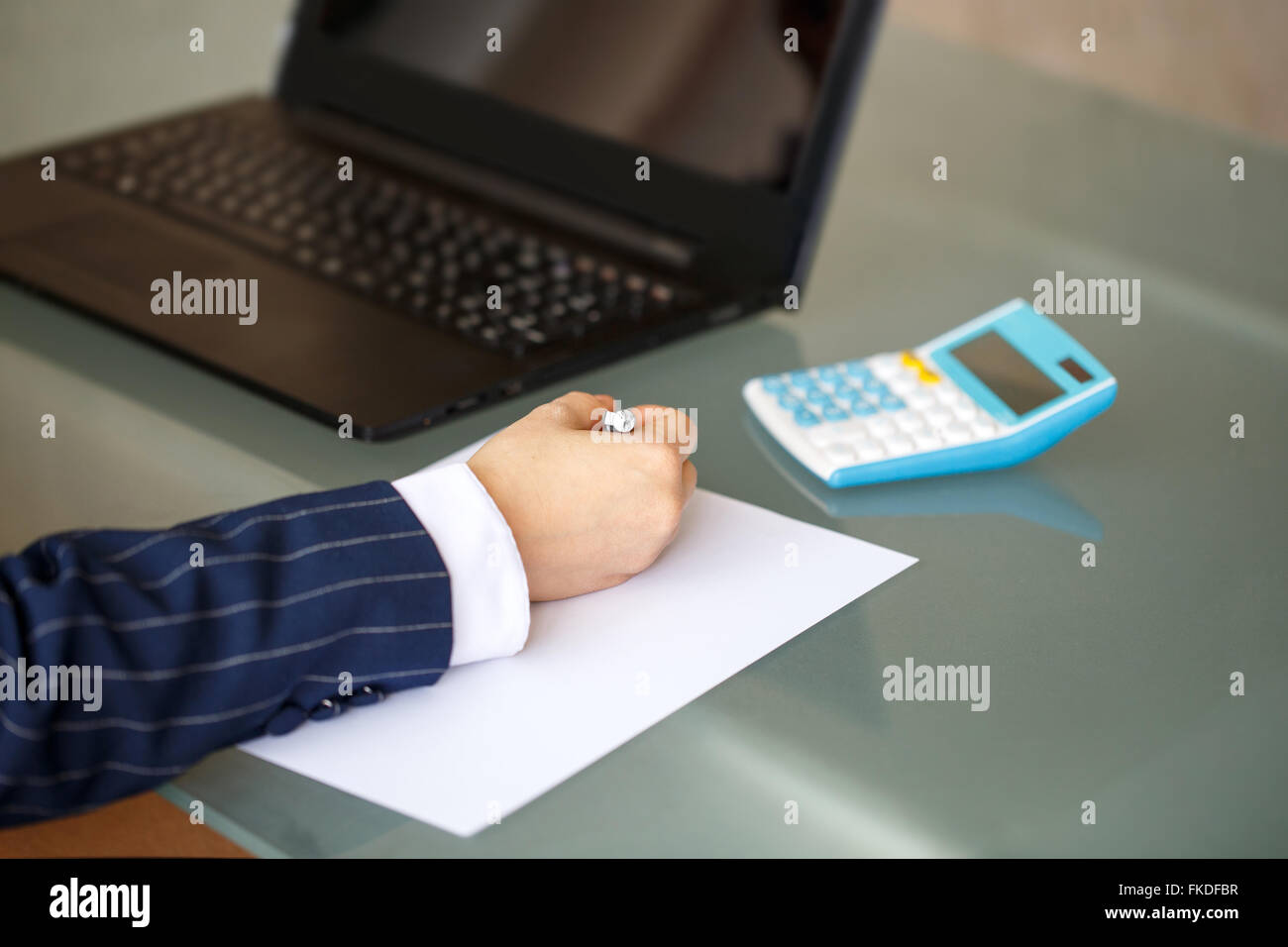 Businesswoman write on blank paper in office Stock Photo - Alamy