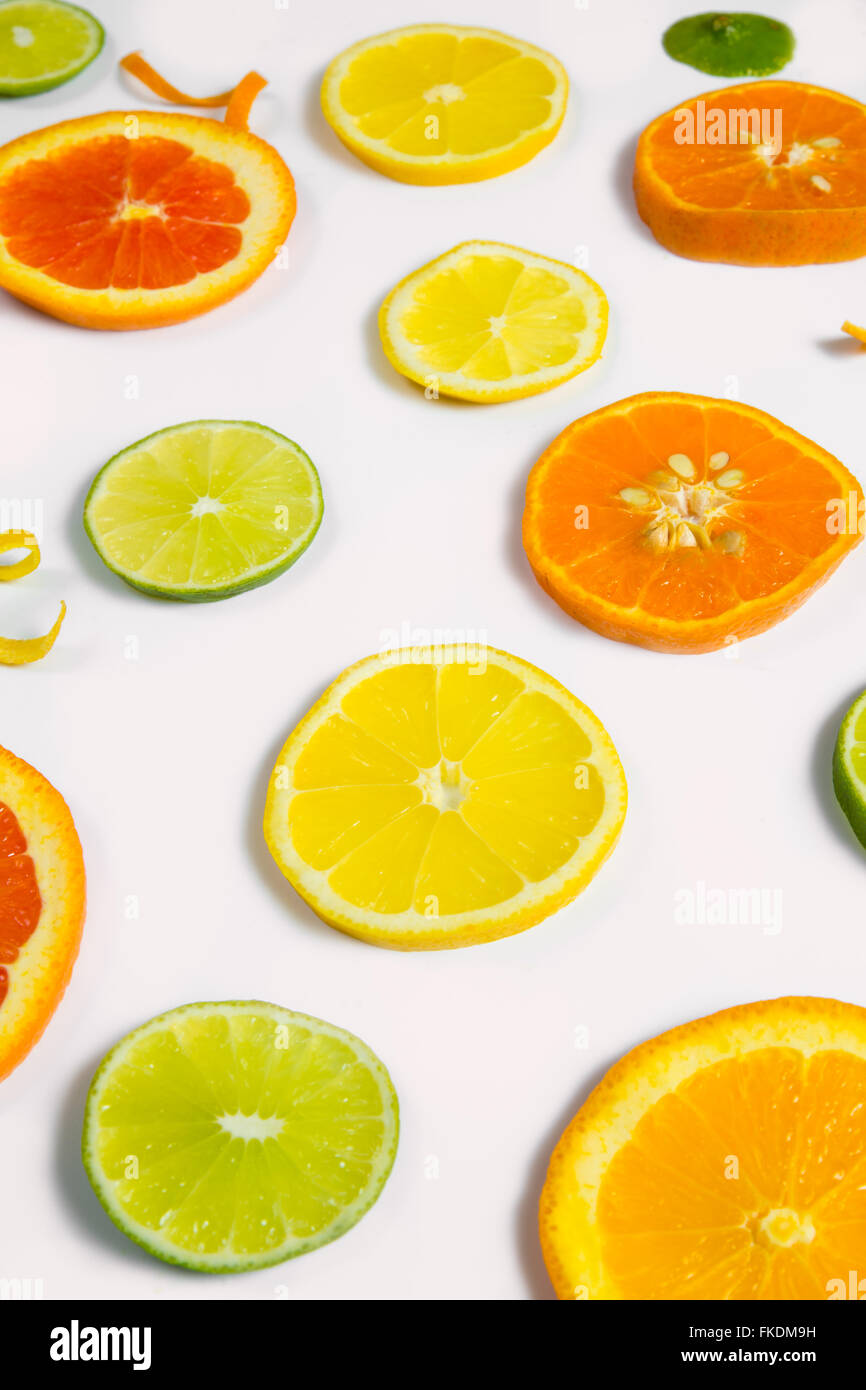 Bright colorful design of various citrus fruit slices with oranges ...
