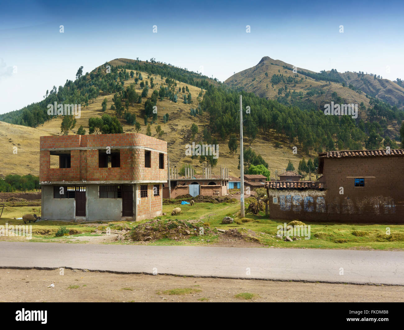 Village on hill with mountain in background, Cusco, Peru Stock Photo ...