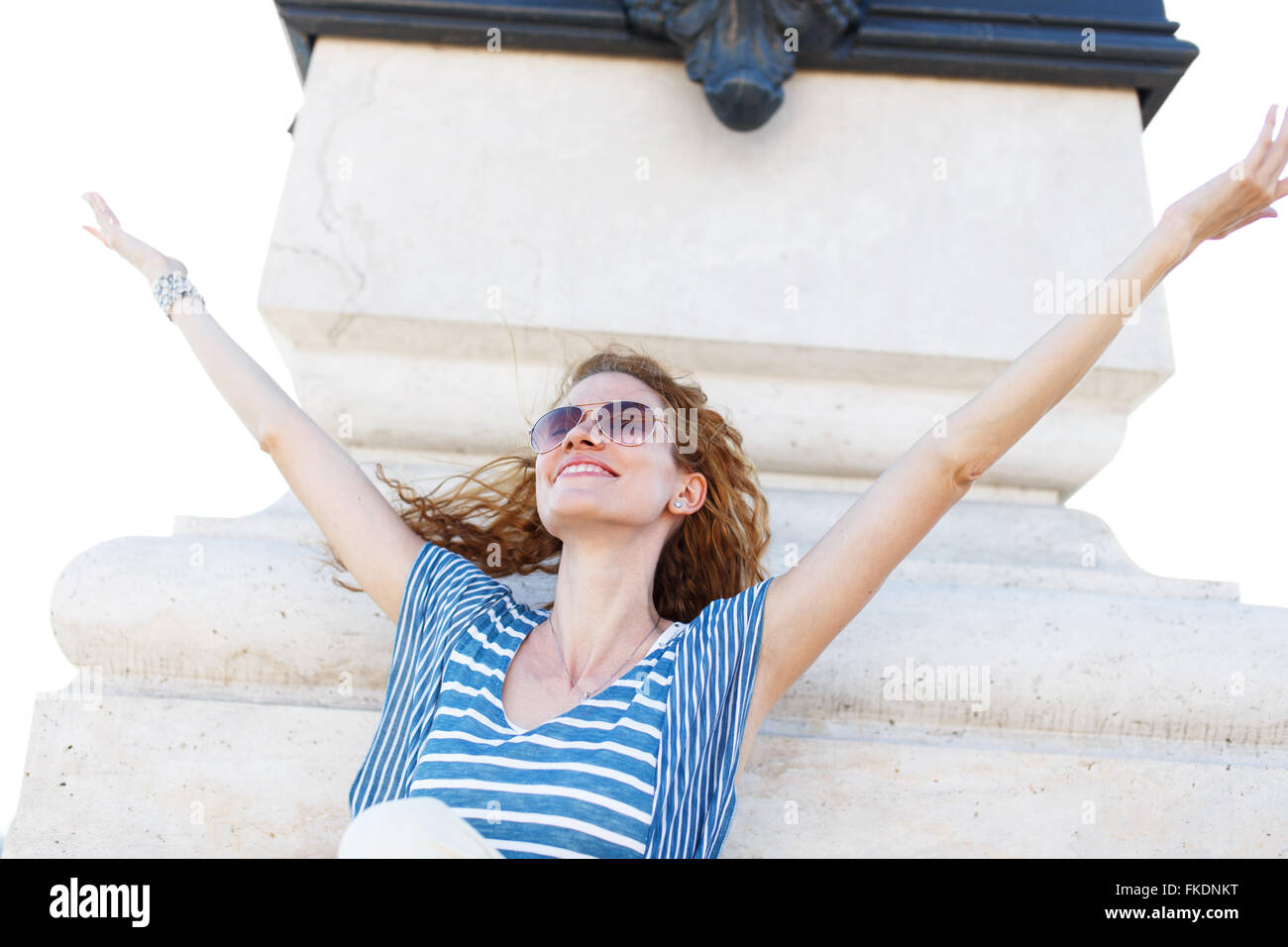 Carefree woman outspread arms outdoor portrait Stock Photo - Alamy