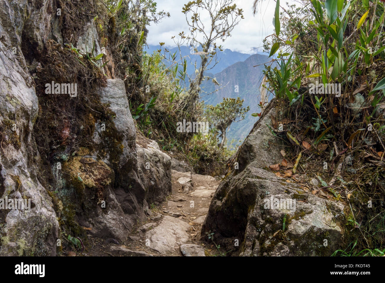 Remote mountain viewed through cliff, Machu Picchu, Cusco Region ...