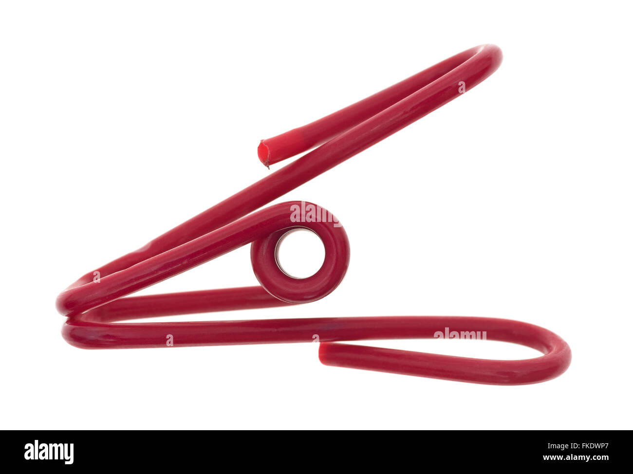 Top view of a red plastic coated wire clip isolated on a white ...