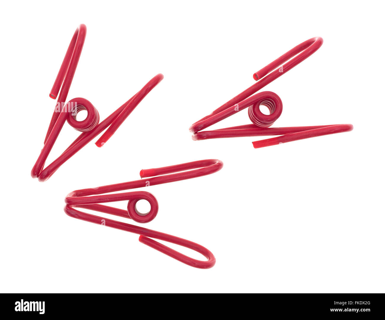 Top view a small group of red plastic coated wire clips isolated on a ...