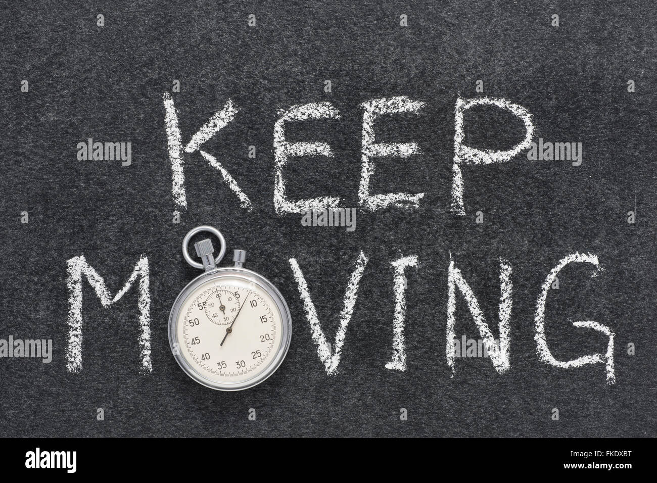 keep moving phrase handwritten on chalkboard with vintage precise ...