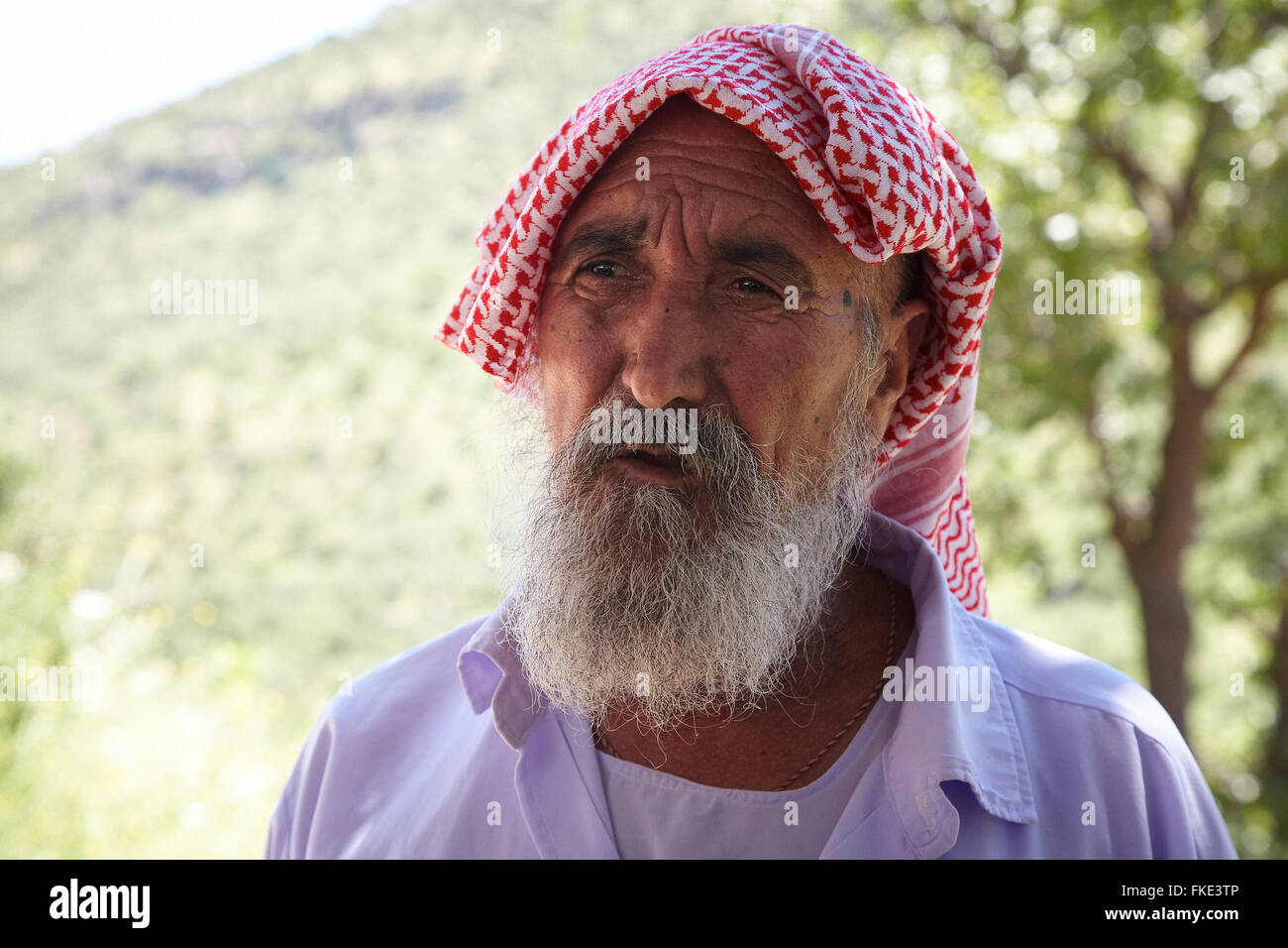 A grieving man in Lalish. The Yazidi holy temple in Iraqi Kurdistan ...