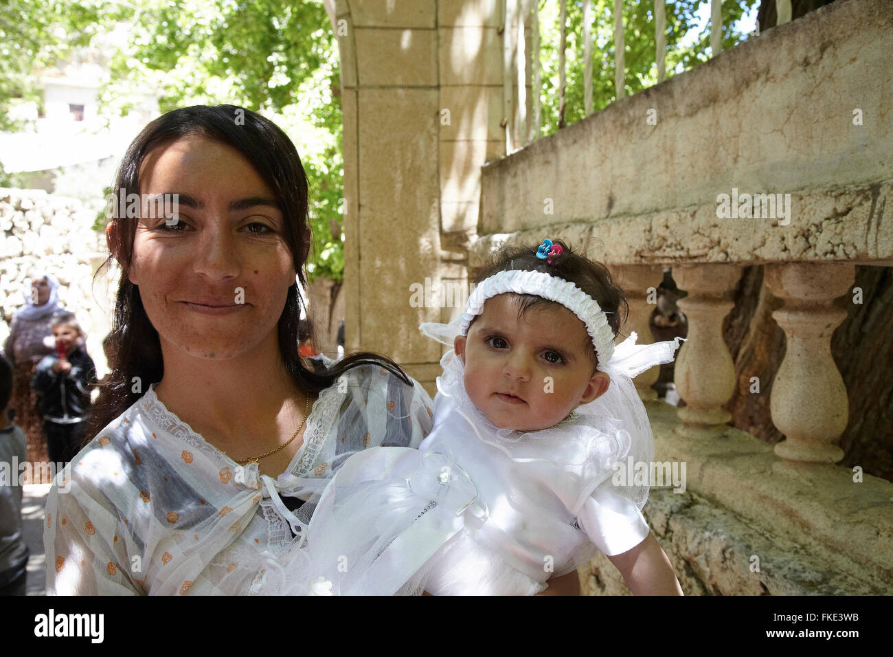 Young Yazidi mother with her baby girl in the Yazidi temple in Lalesh ...